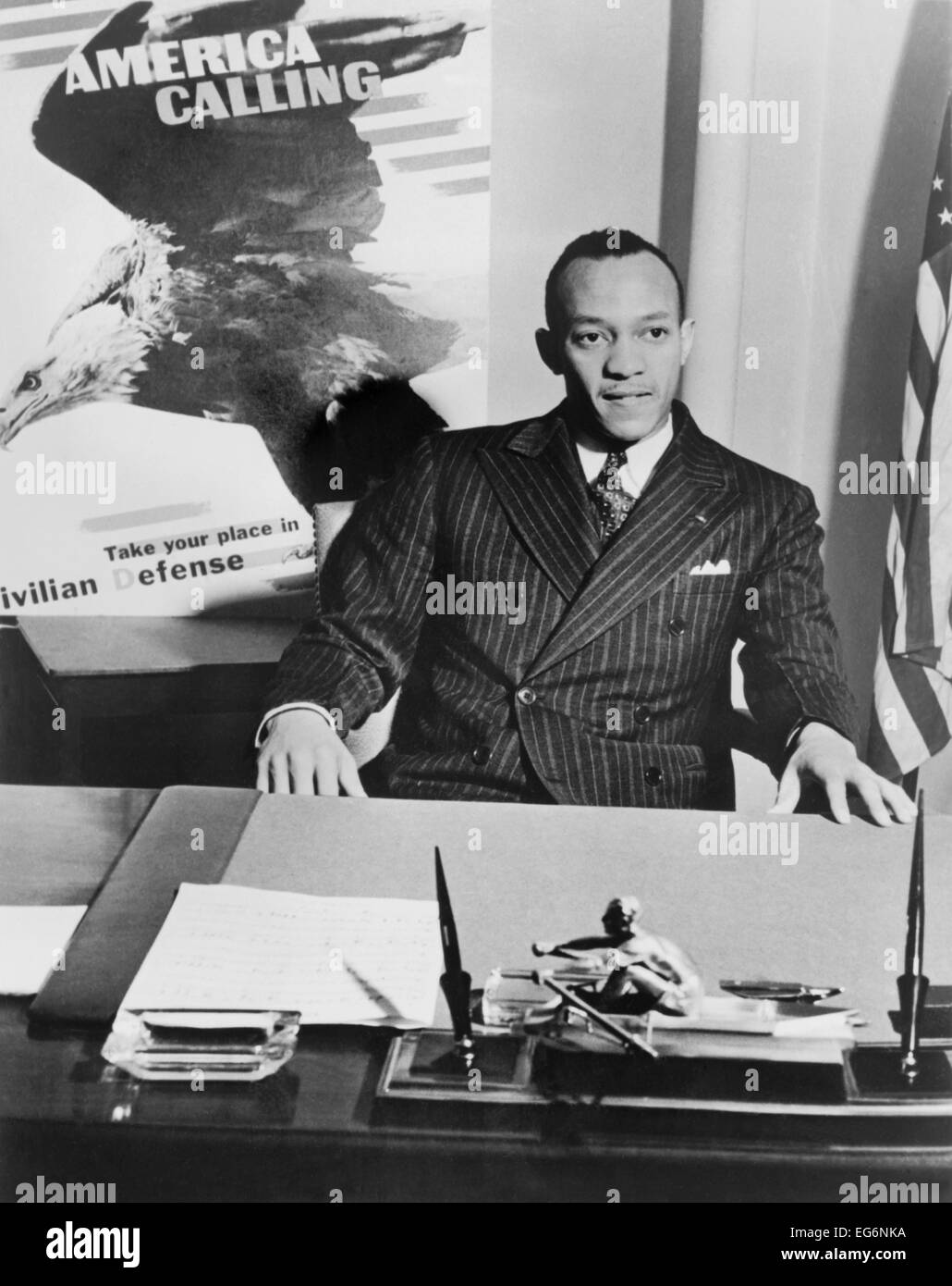 Jesse Owens Half Length Portrait Seated At Desk As National Coordinator Of Racial Activities
