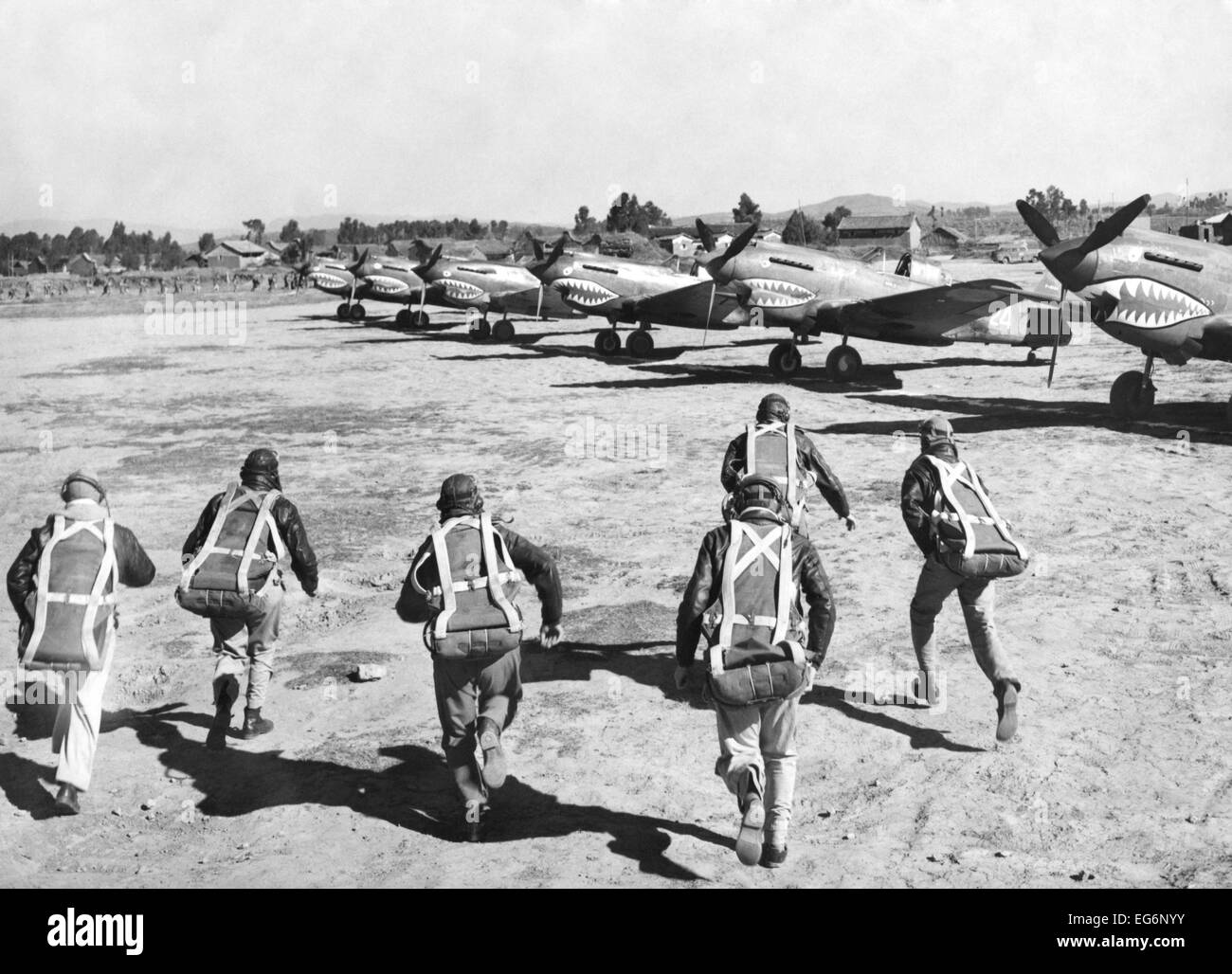 U.S. Flying Tiger pilots run to their fighter planes at an advanced U.S ...