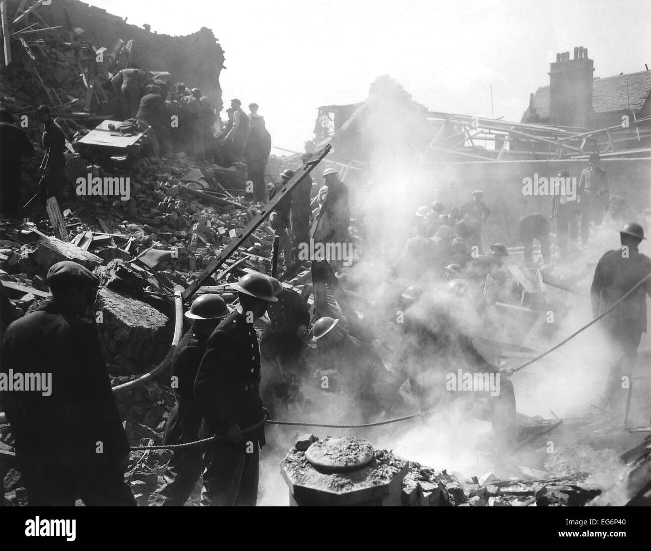British firemen and civilians at wreckage caused by German unmanned ...