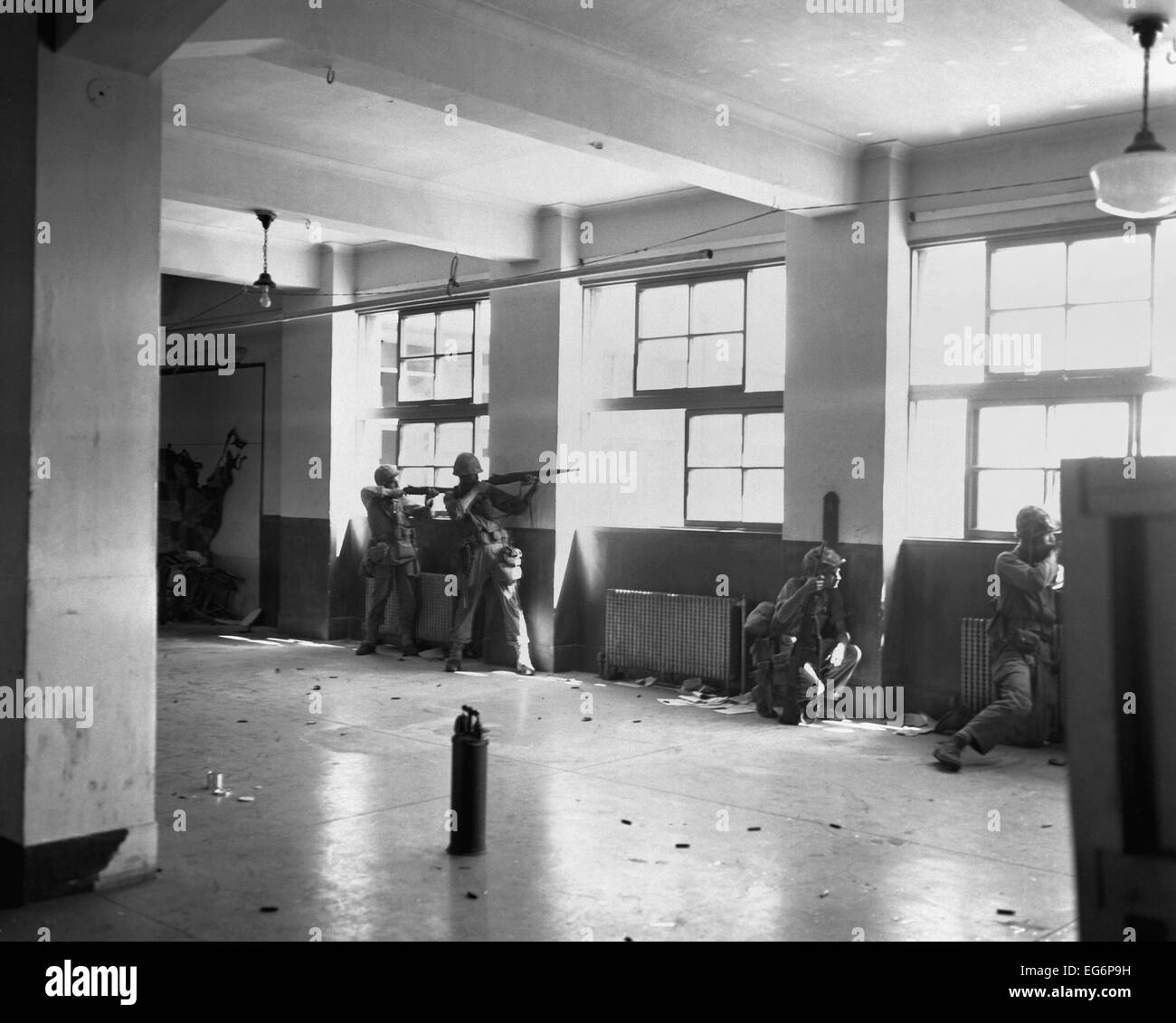 U.S. Marines in concrete building firing from alternate positions to ...