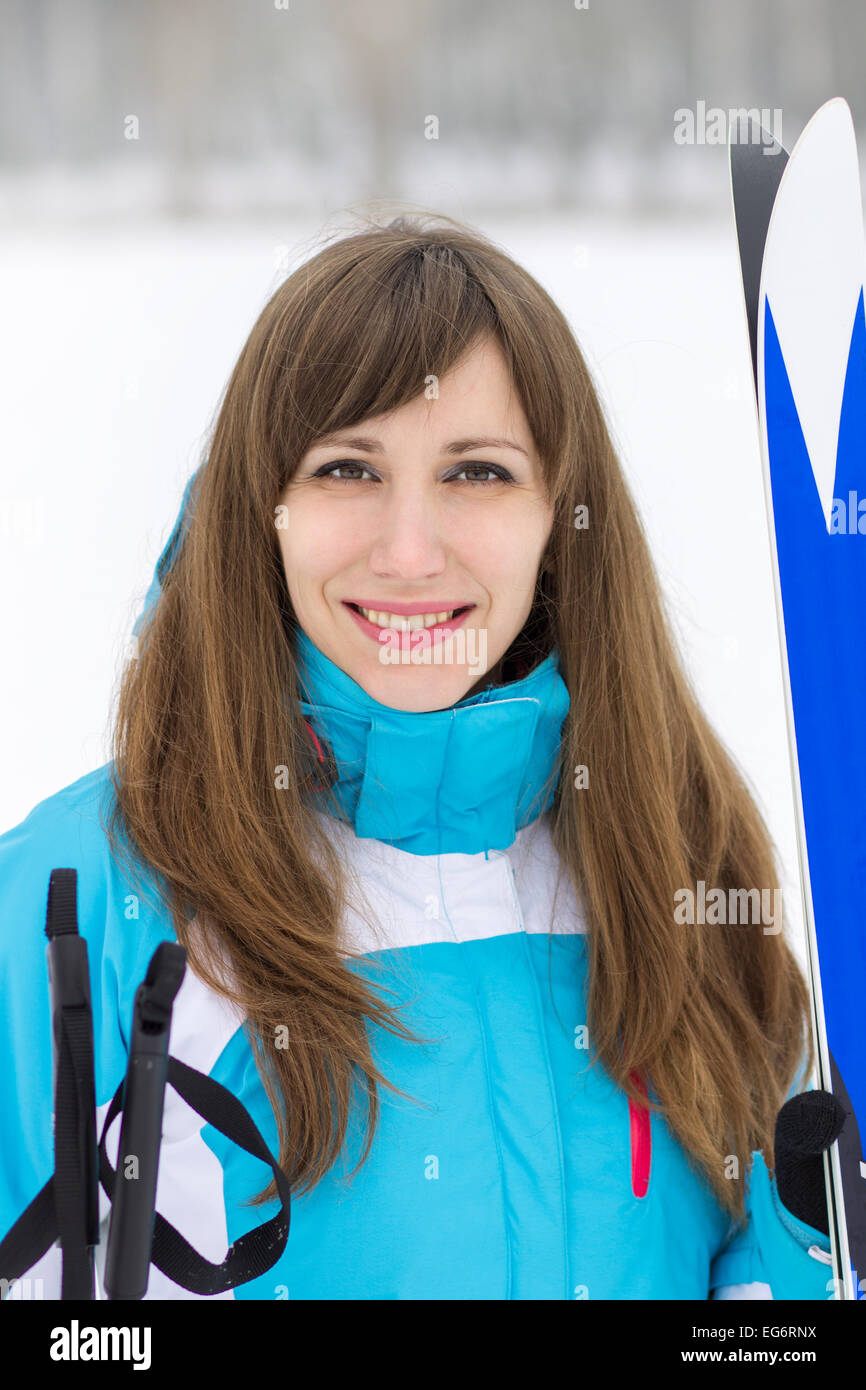 Young pretty woman going to skiing. Caucasian smiling girl with ski at ...