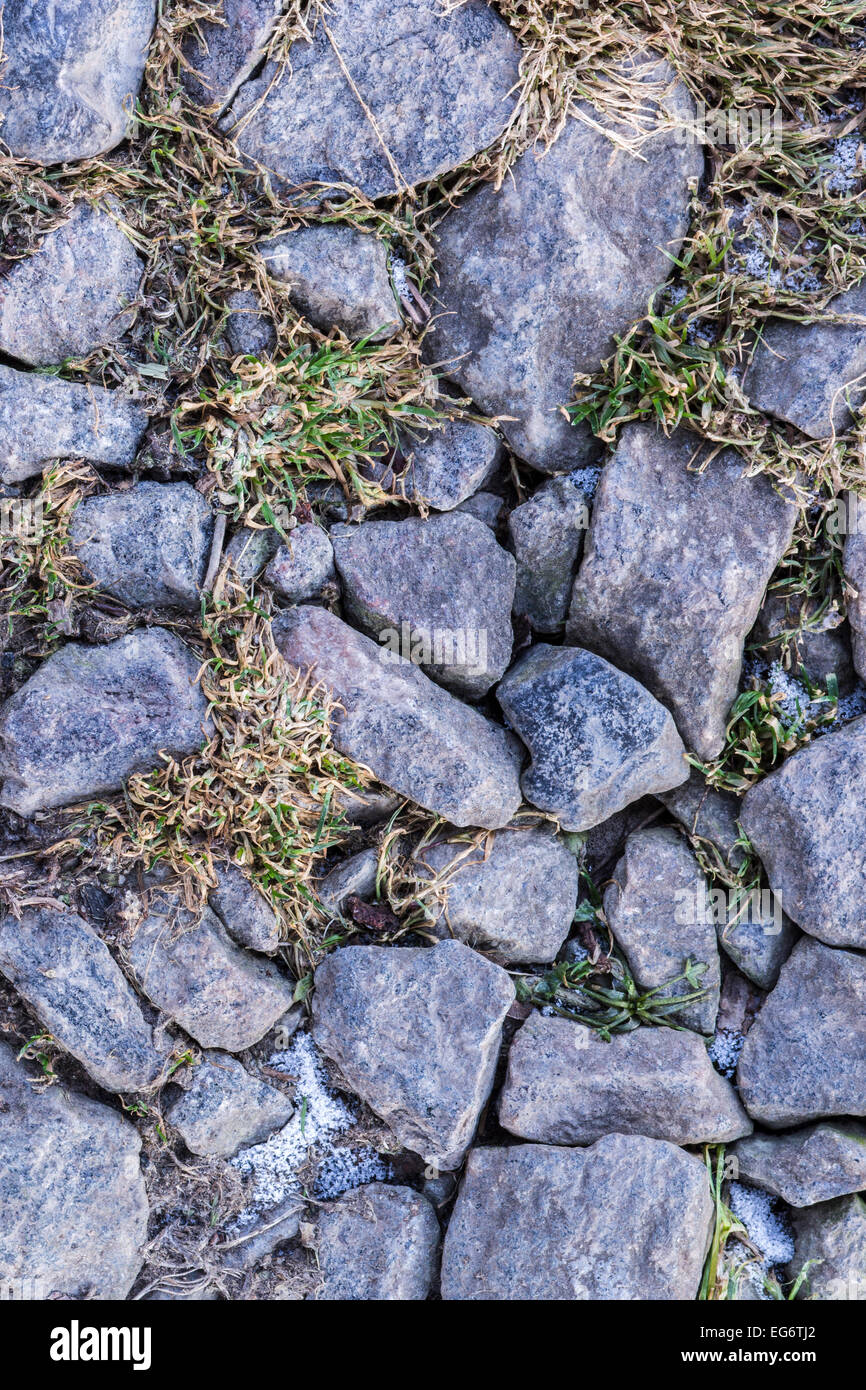 Abstract winter texture background. Stones, snow and grass in nature ...