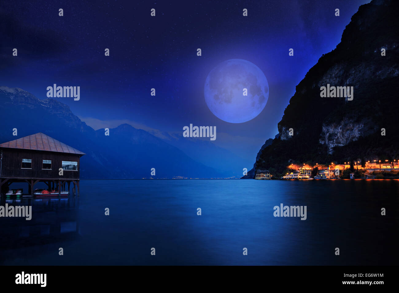 a mountain lake by night with full moon Stock Photo - Alamy