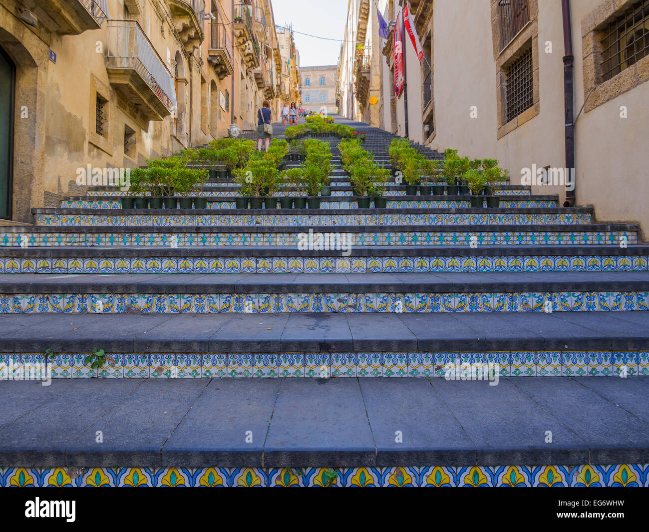 The Santa Maria del Monte staircase with ceramic tiles and potted ...