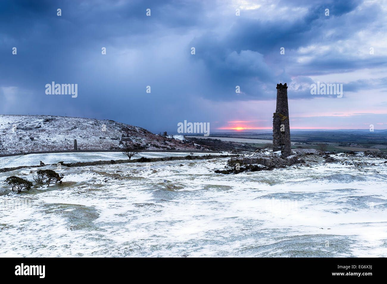 Snow over ruined chimney stacks left over from tin and Copper mining at ...