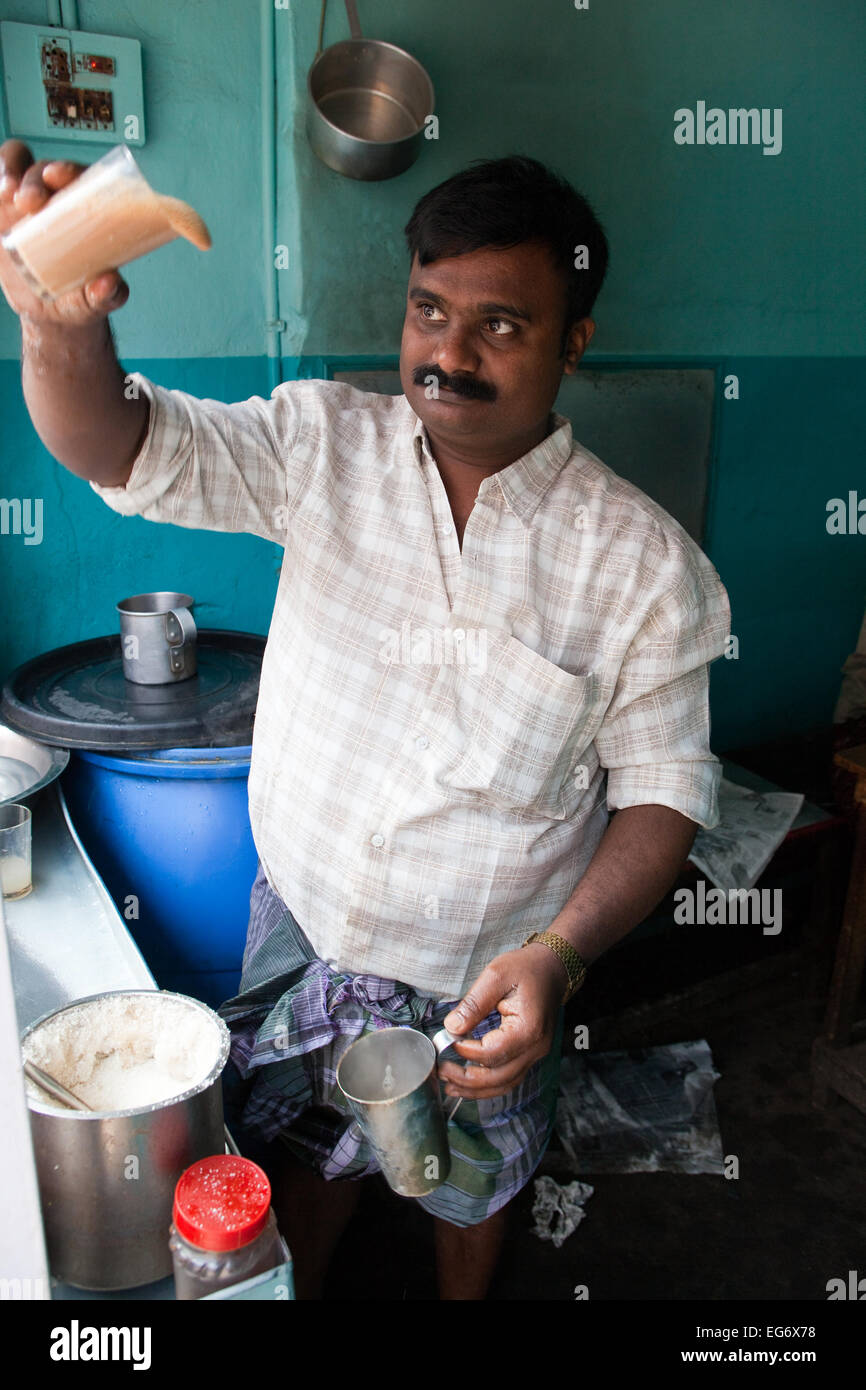 'Chai wallah' or tea maker - tea man pours his chai between glasses ...
