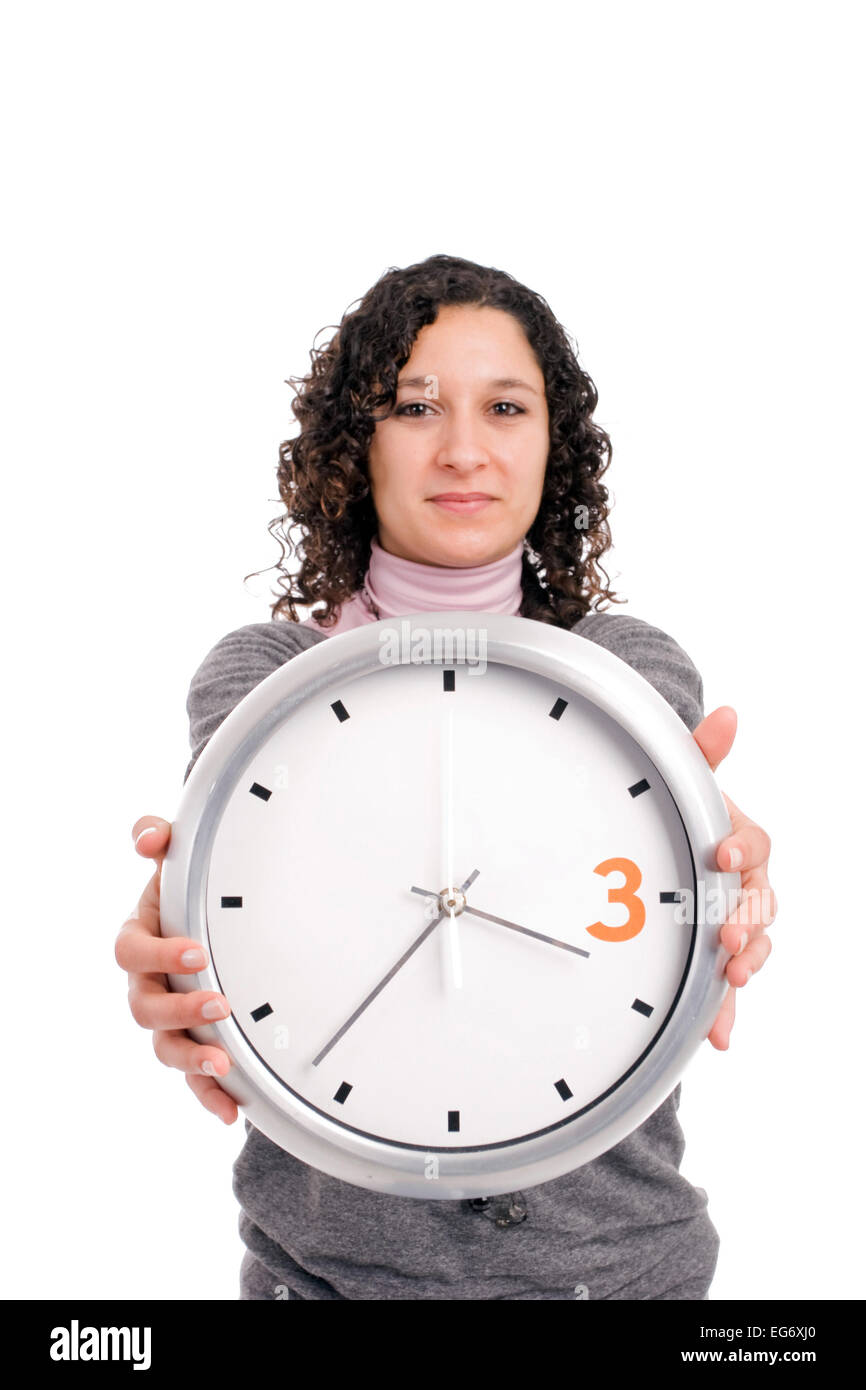 Casual woman waiting for a meeting, holding a clock Stock Photo - Alamy