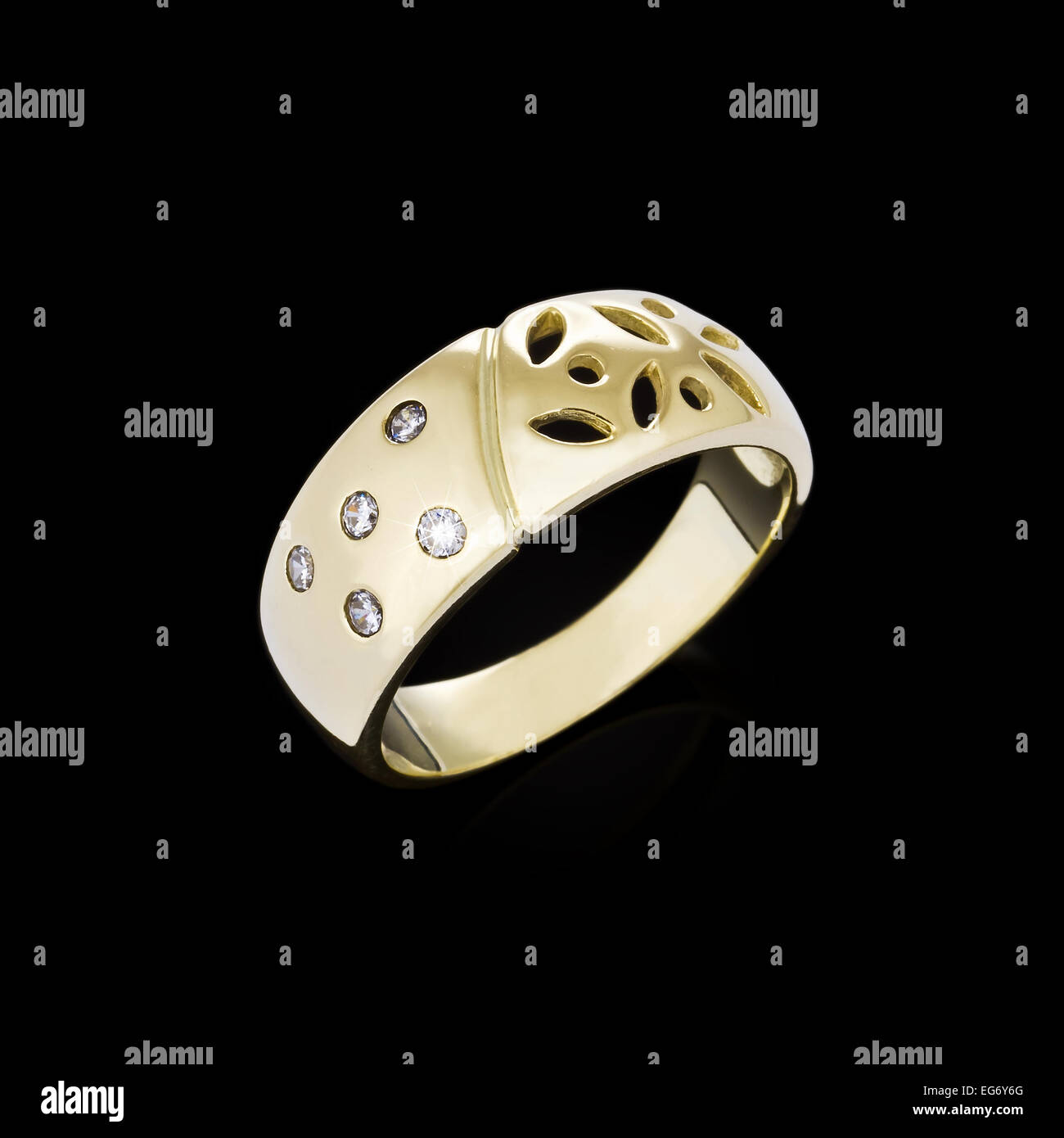 Gold ring on black background Stock Photo - Alamy