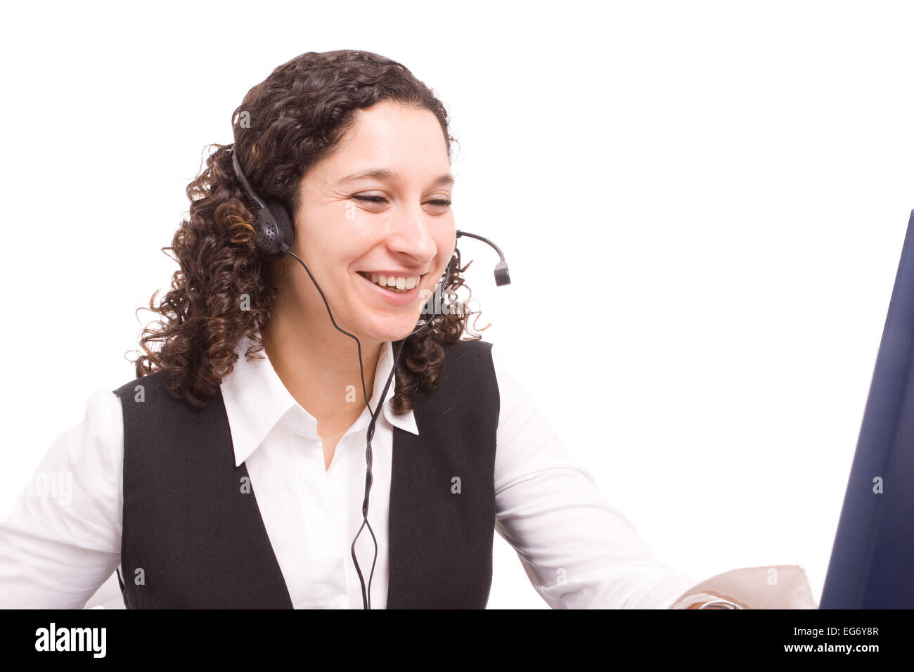 Friendly telephone operator working with laptop Stock Photo - Alamy