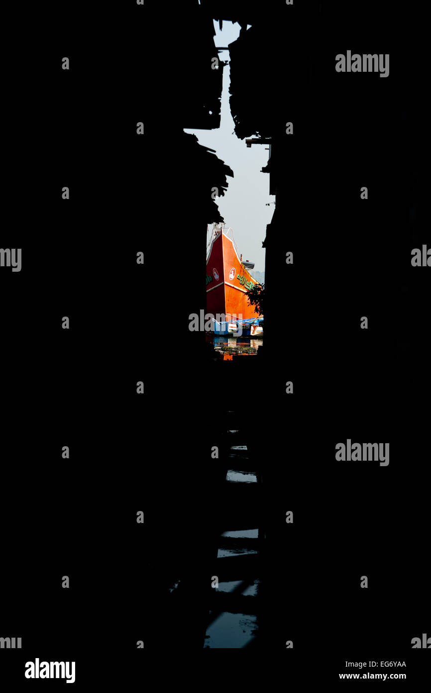 A ship shot between the crack of crumbling derelict buildings Stock ...