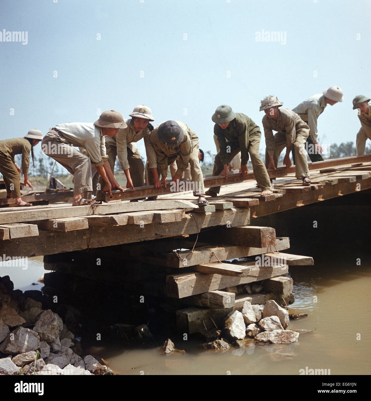 Young Vietnamese people of a so-called youth brigade build a temporary ...