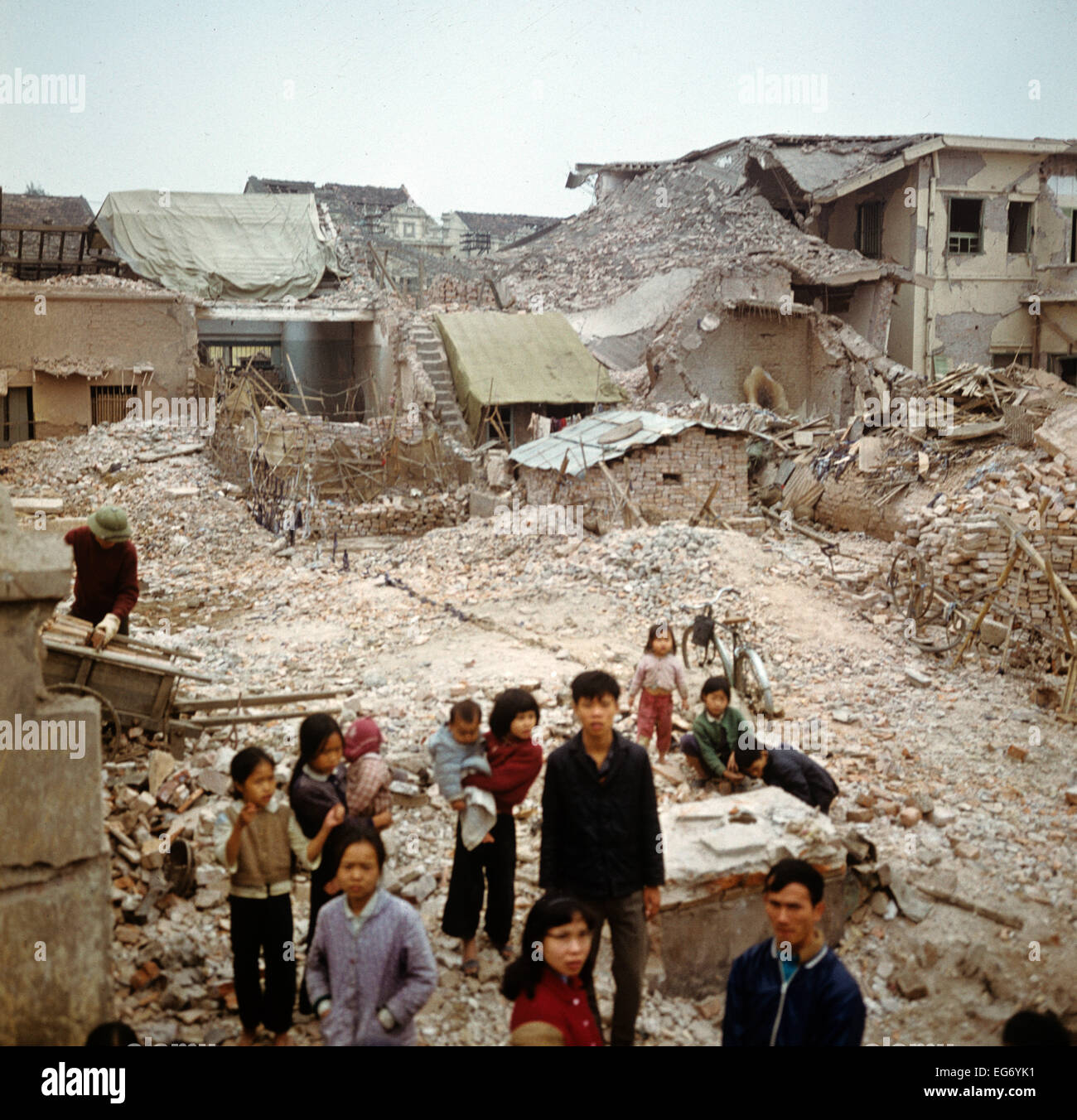 War-destroyed houses, ruins, debris and provisional huts in Kham Thien ...