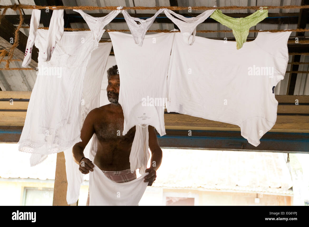Locals washing clothes hi-res stock photography and images - Alamy