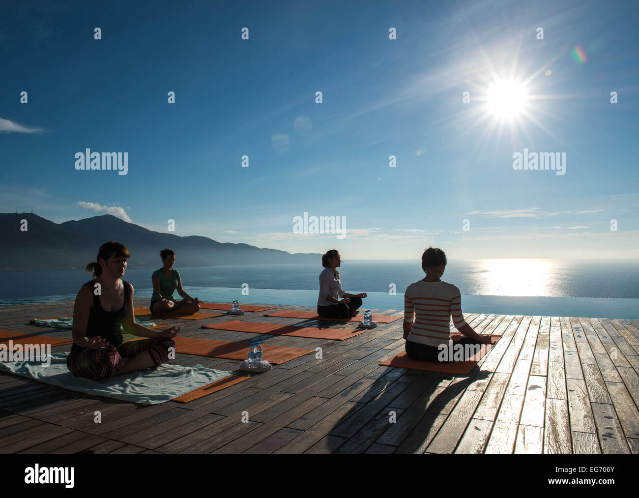 Hotel guests during Qi Gong on the rooftop of hotel 'A la carte' at My ...