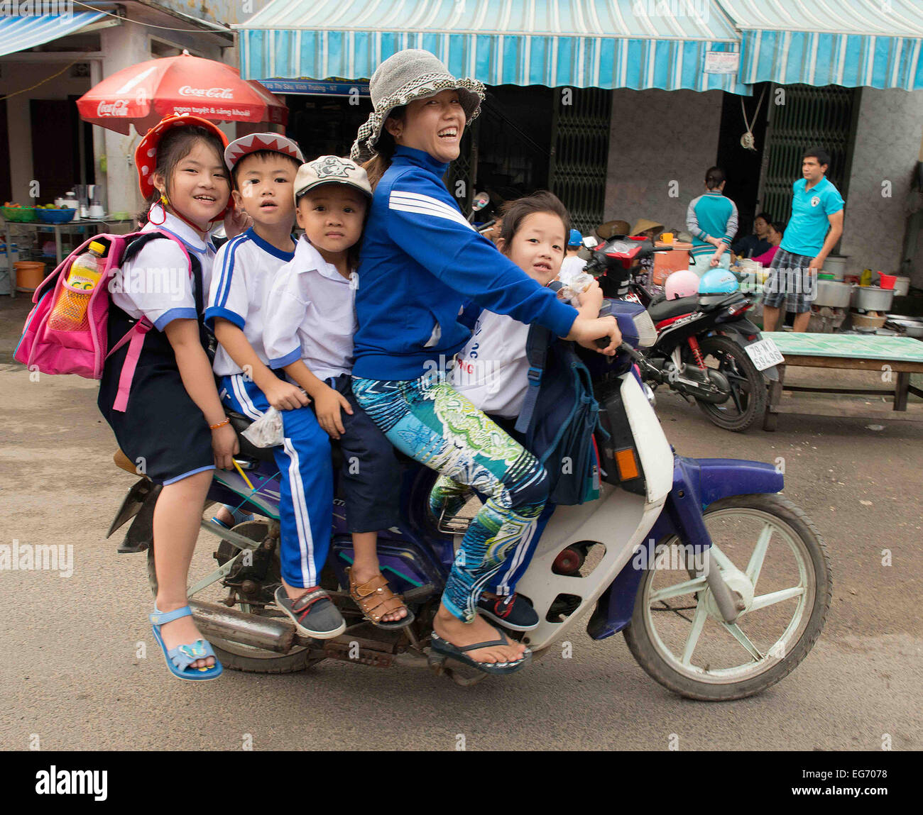Children drive home from school on a moped in Nha Trang on 28th August ...