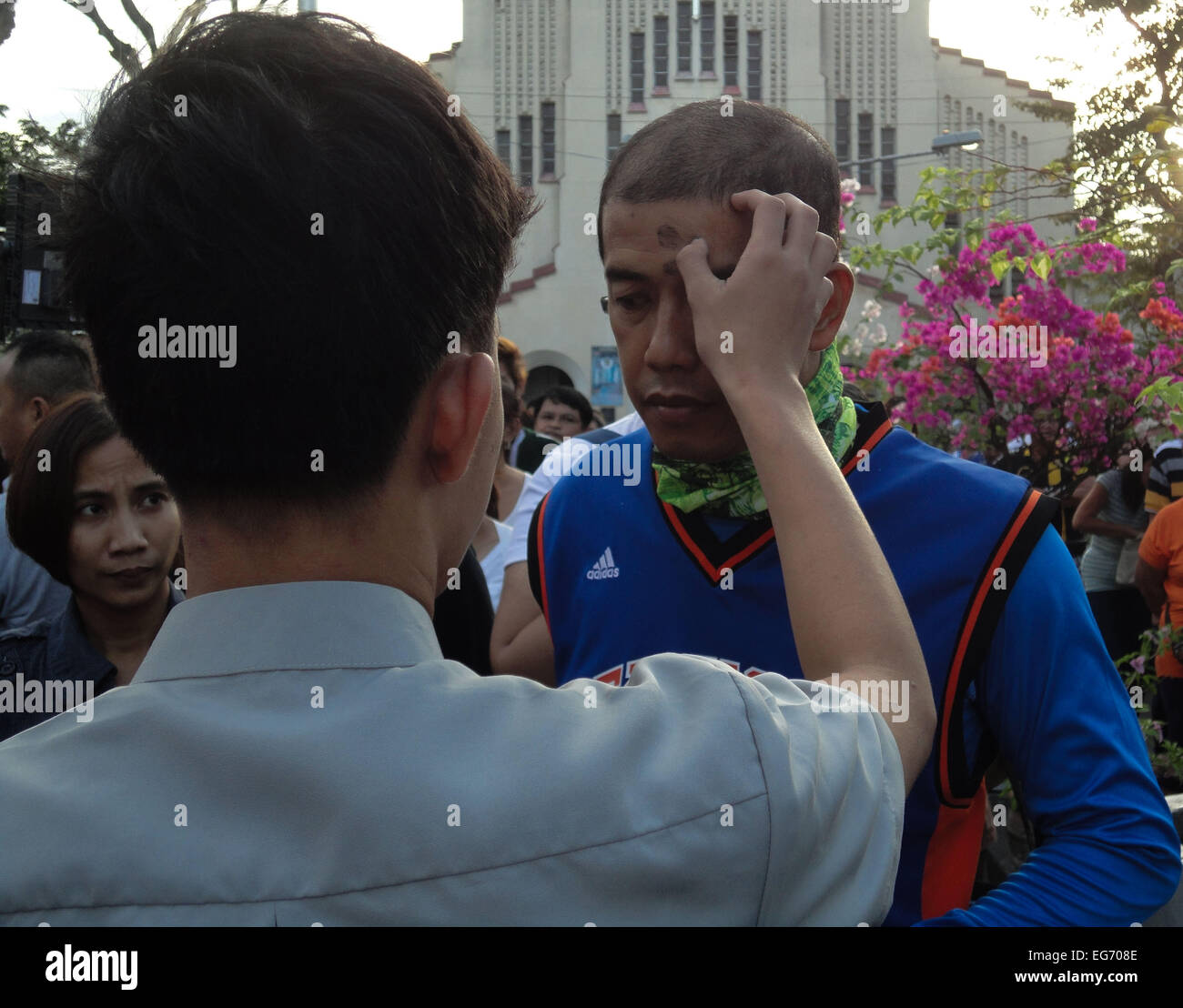 Manila, Philippines. 18th Feb, 2015. A Filipino church lay minister ...