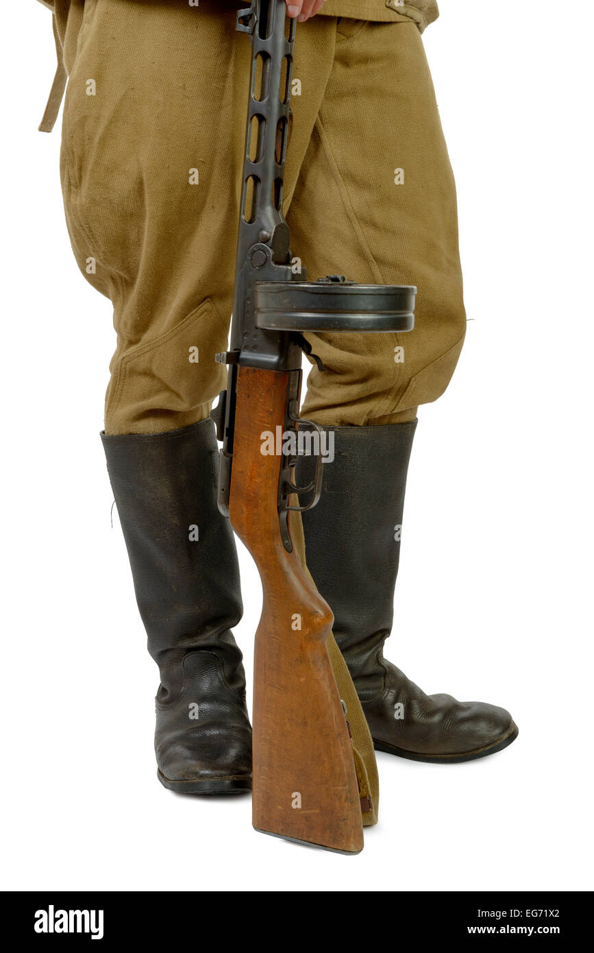 Soviet machine gun at the foot of a soldier on the white background ...