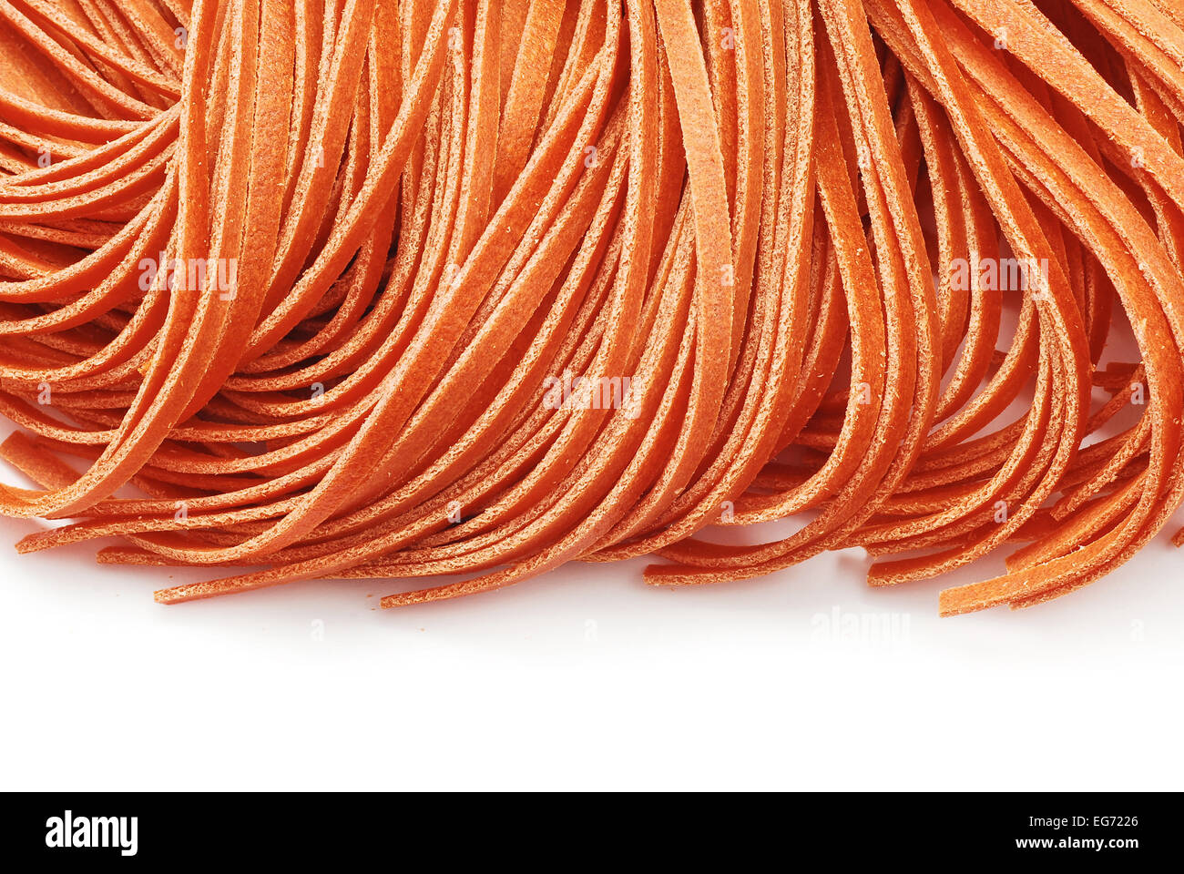 Long raw pasta on red hi-res stock photography and images - Alamy