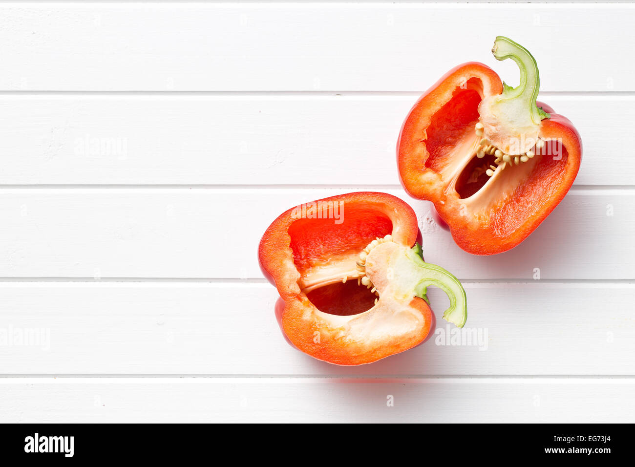 top view of halved red bell pepper on table Stock Photo - Alamy