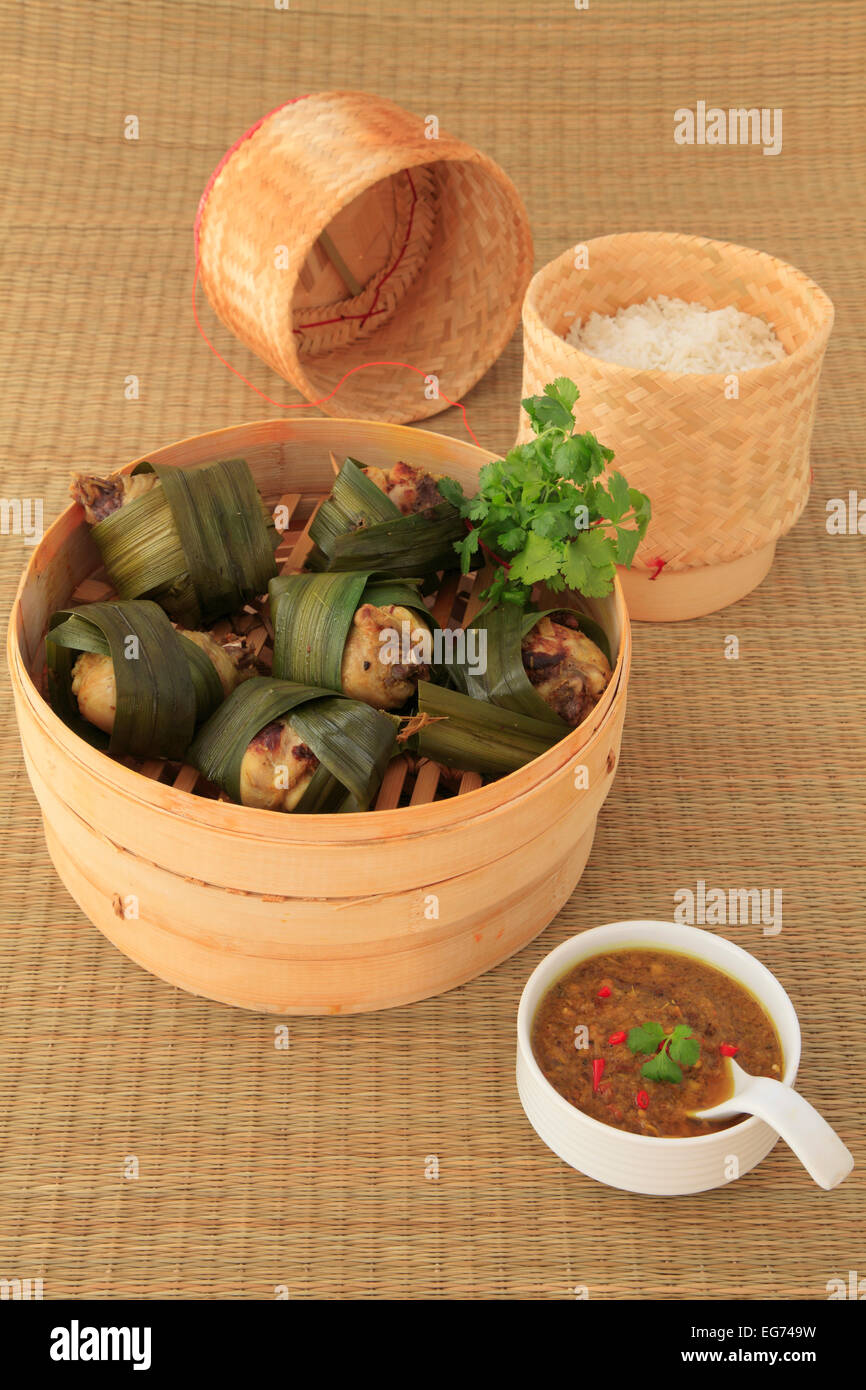 Steamed chicken, with pandanus leaves, Thai dish Stock Photo - Alamy