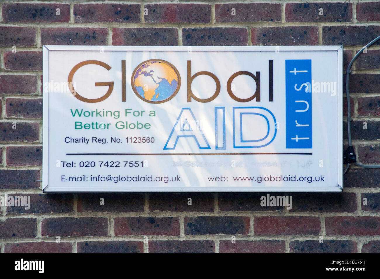 Sign outside the premises of charity Global Aid Trust Stock Photo - Alamy
