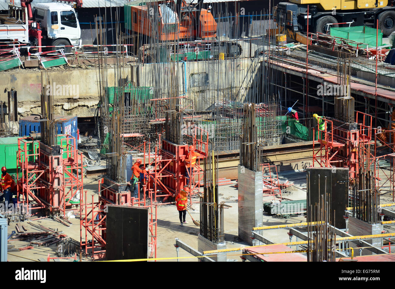 People and Machinery working on Building Business Construction Site at ...
