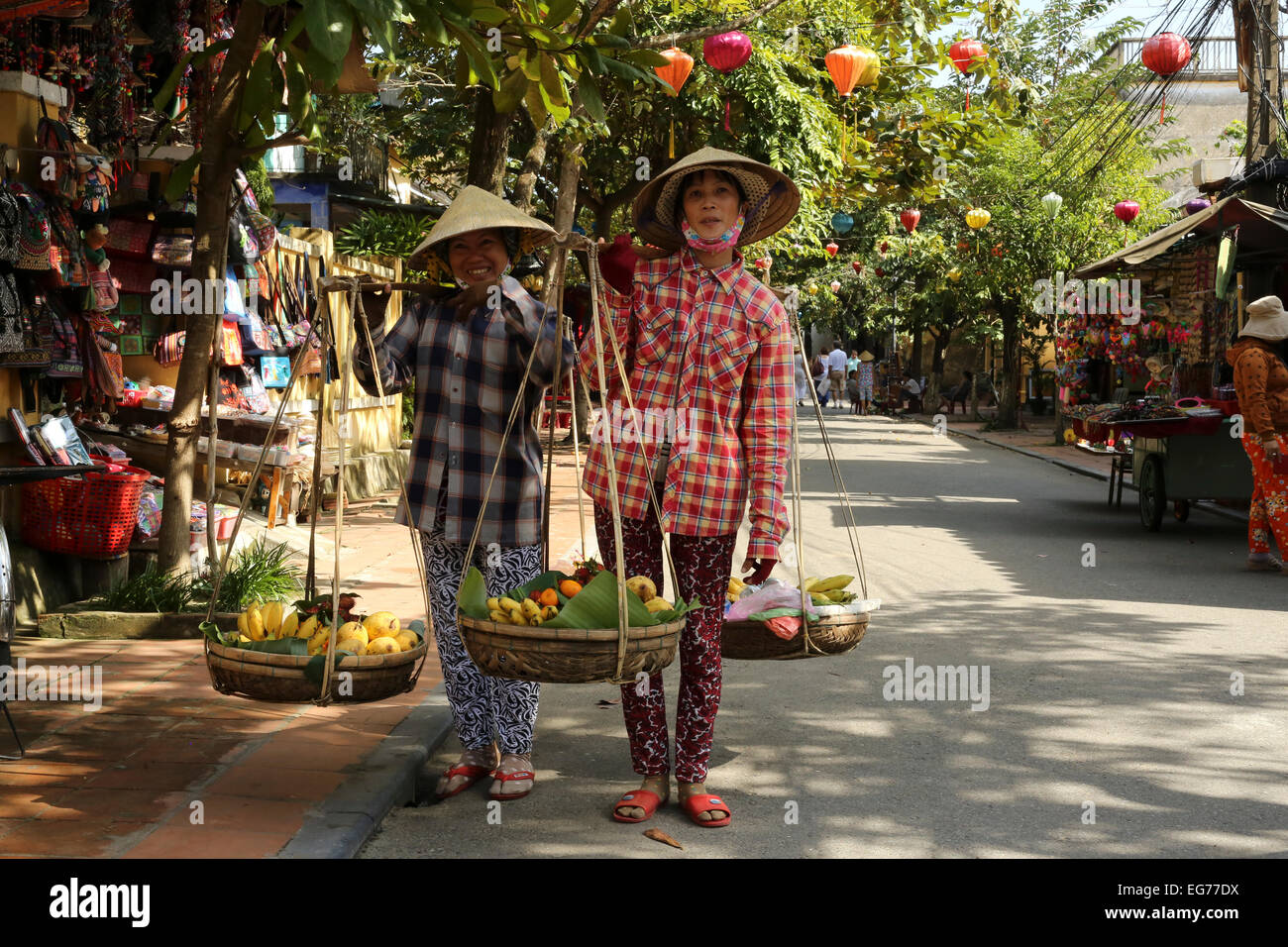 Vietnam, Hoi An, Two fruit carriers Stock Photo - Alamy