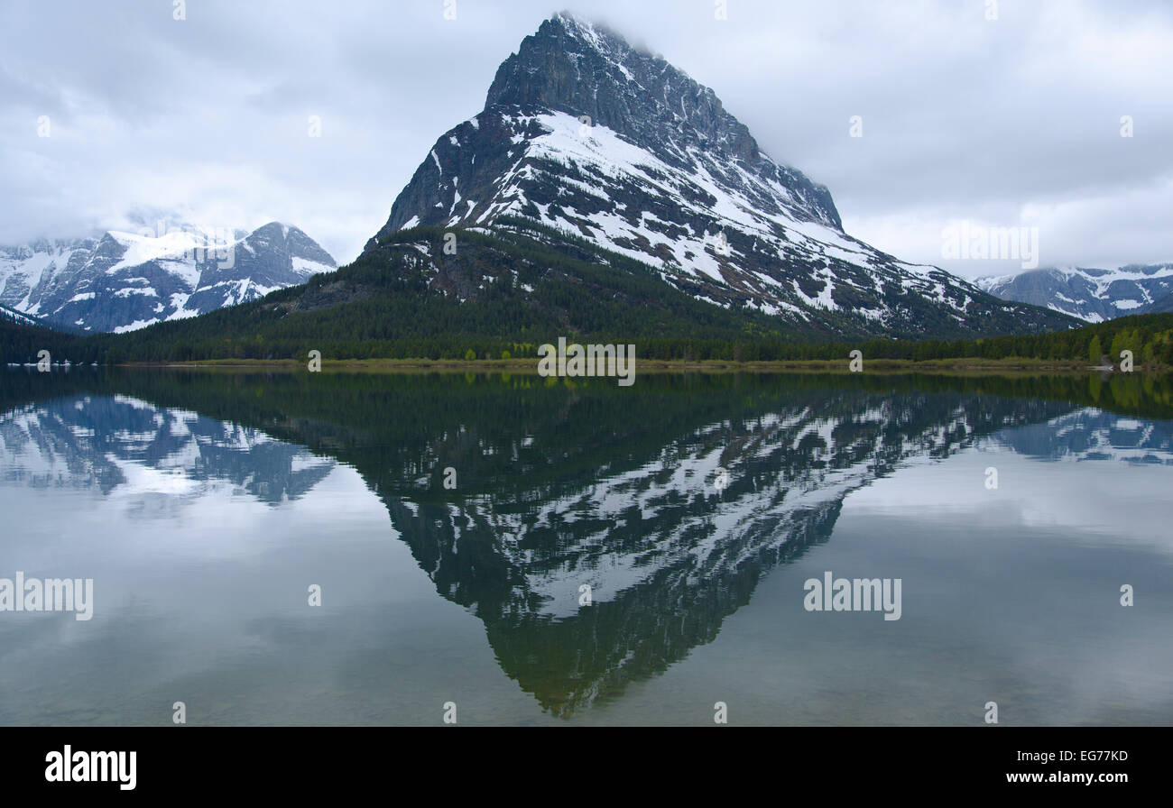 Late spring reflections at Swiftcurrent lake - Glacier National Park ...