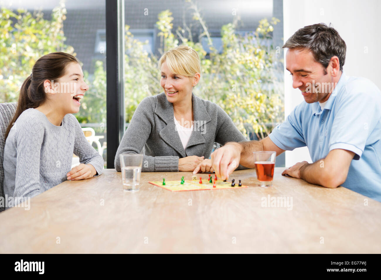 Family playing ludo at home Stock Photo - Alamy