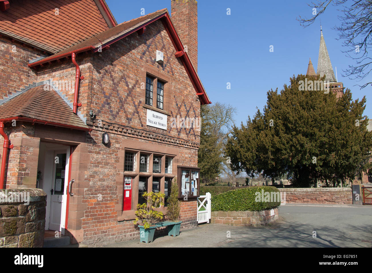Village of Aldford, England. Picturesque view of the village store with ...