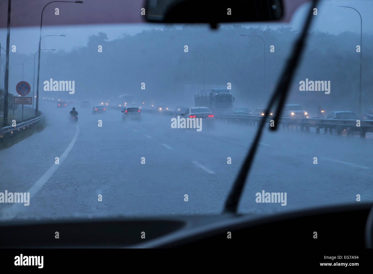 Driving in heavy rain on a highway in Malaysia Stock Photo - Alamy