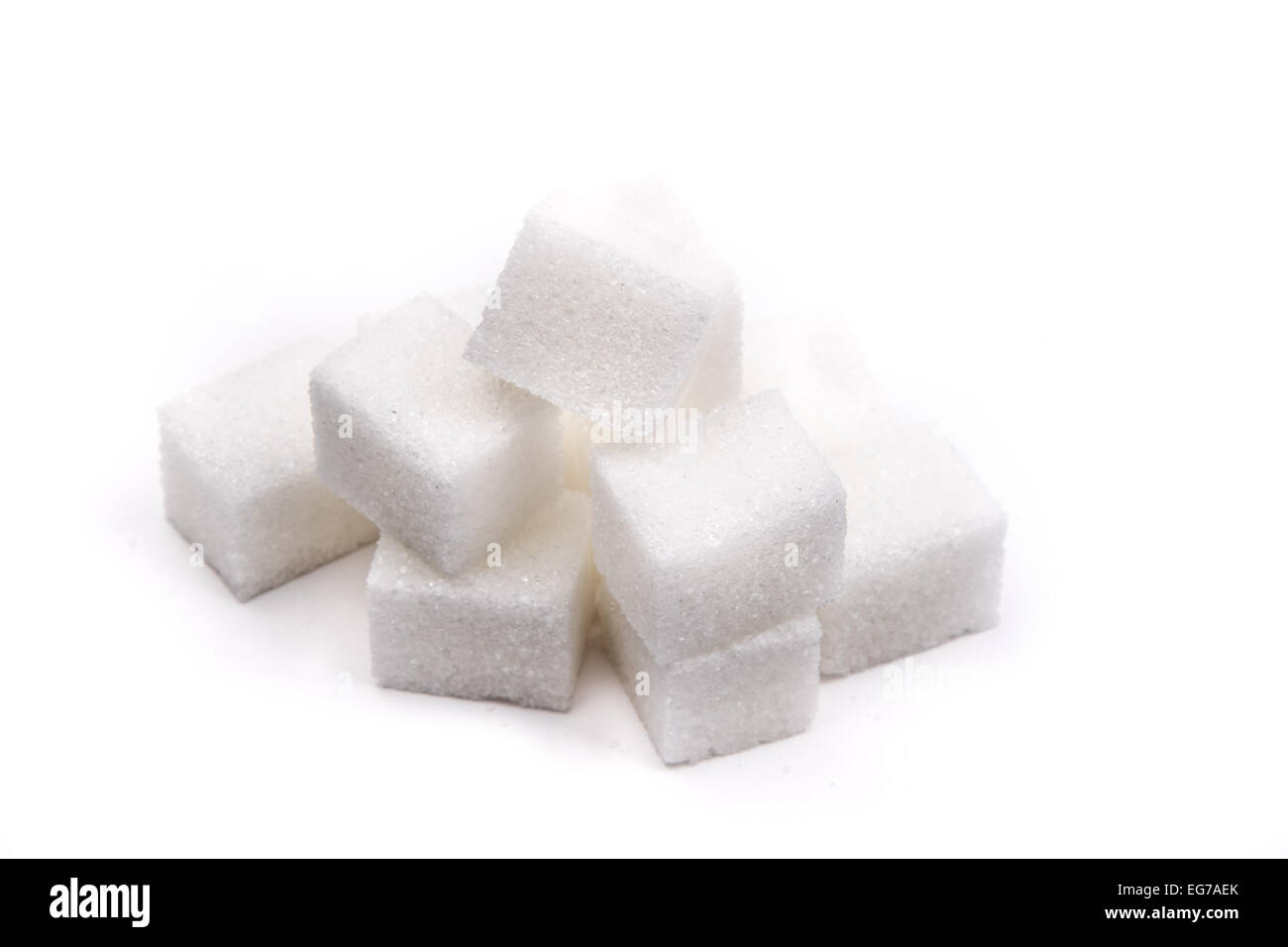 Pile white sugar cubes Cut Out Stock Images & Pictures - Alamy
