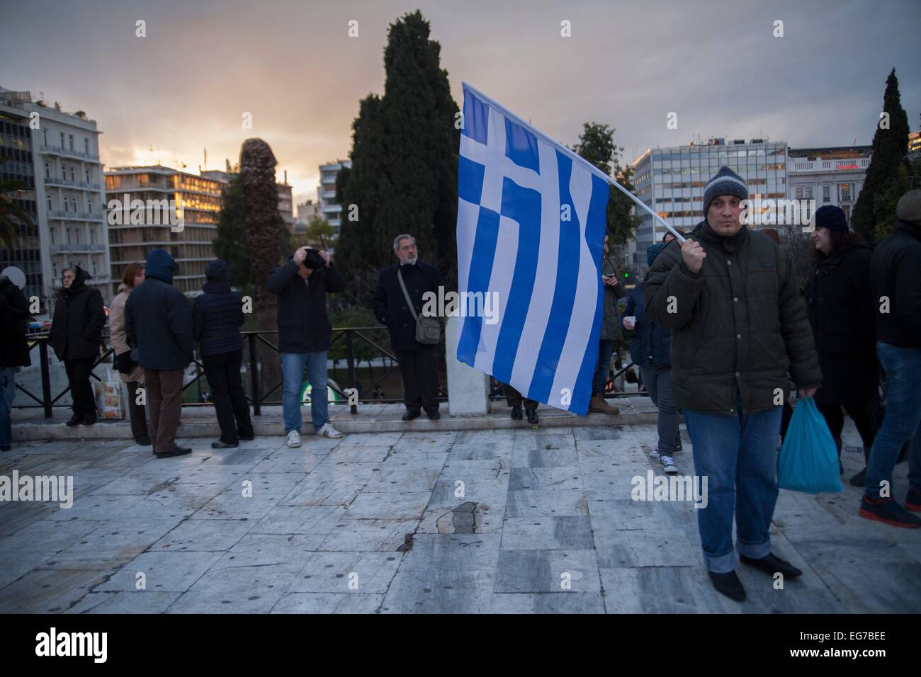 Greek man with Greek flag. Protest of Greeks for support for ...