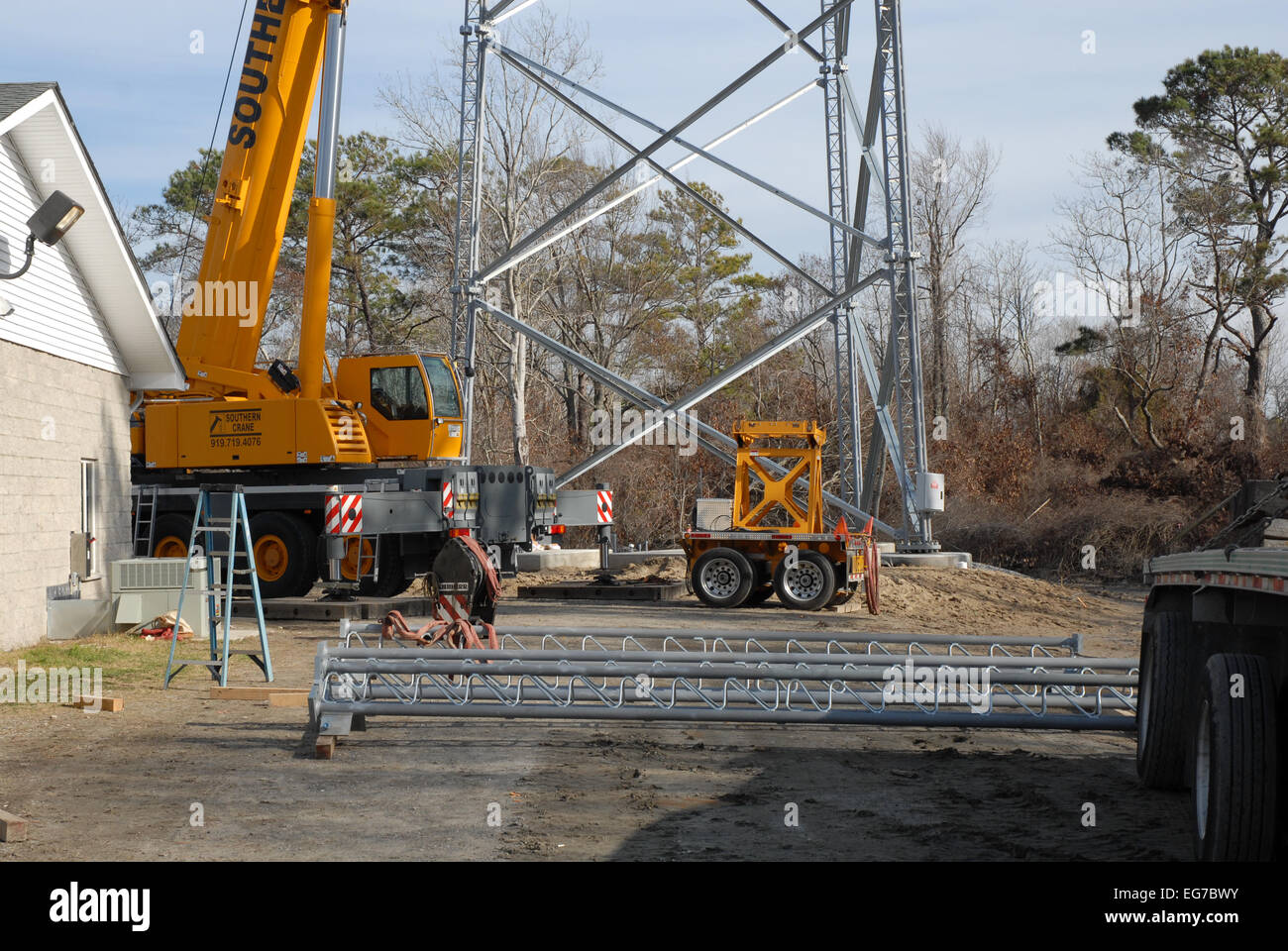 A Crane being used to construct a Cellphone Tower Stock Photo - Alamy