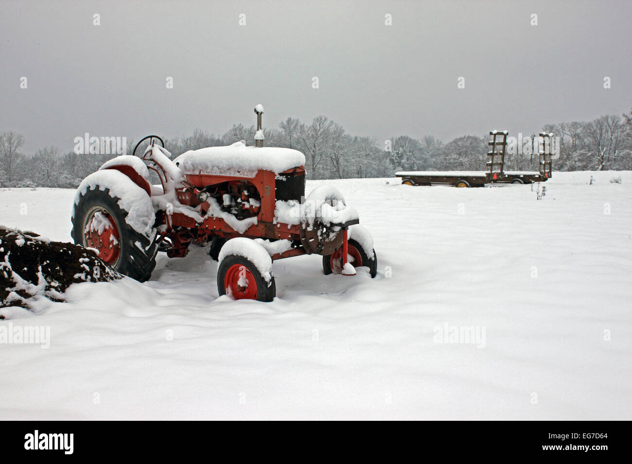 snow covered tractor Stock Photo - Alamy
