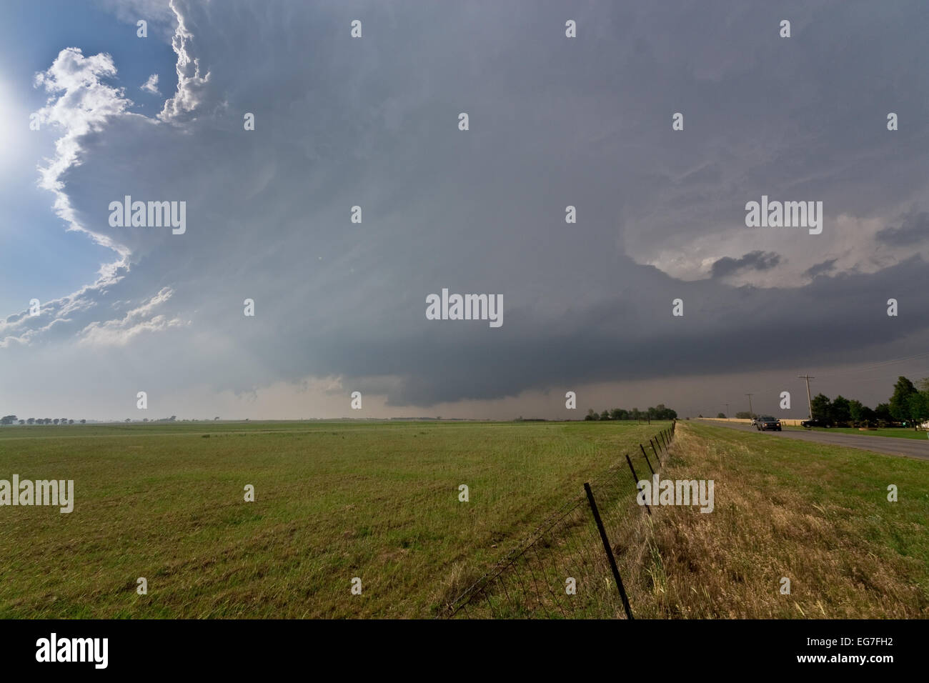A powerful supercell thunderstorm takes shapes with a twisting updraft ...