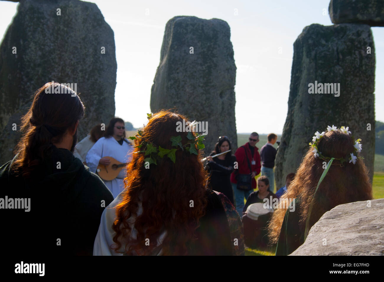 Druid Festival at Stonehenge flowers in hair and swardbearers Stock ...
