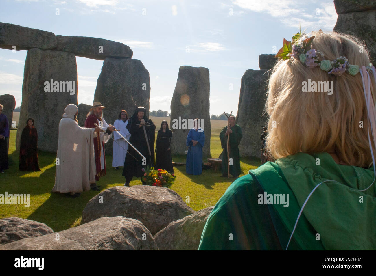 Druid Festival at Stonehenge flowers in hair and swardbearers Stock ...