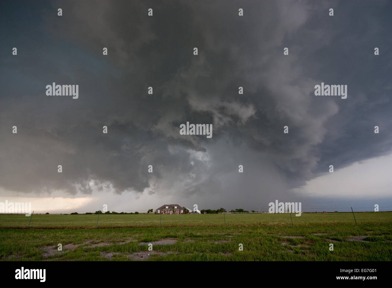 A powerful supercell thunderstorm takes shapes with a twisting updraft ...