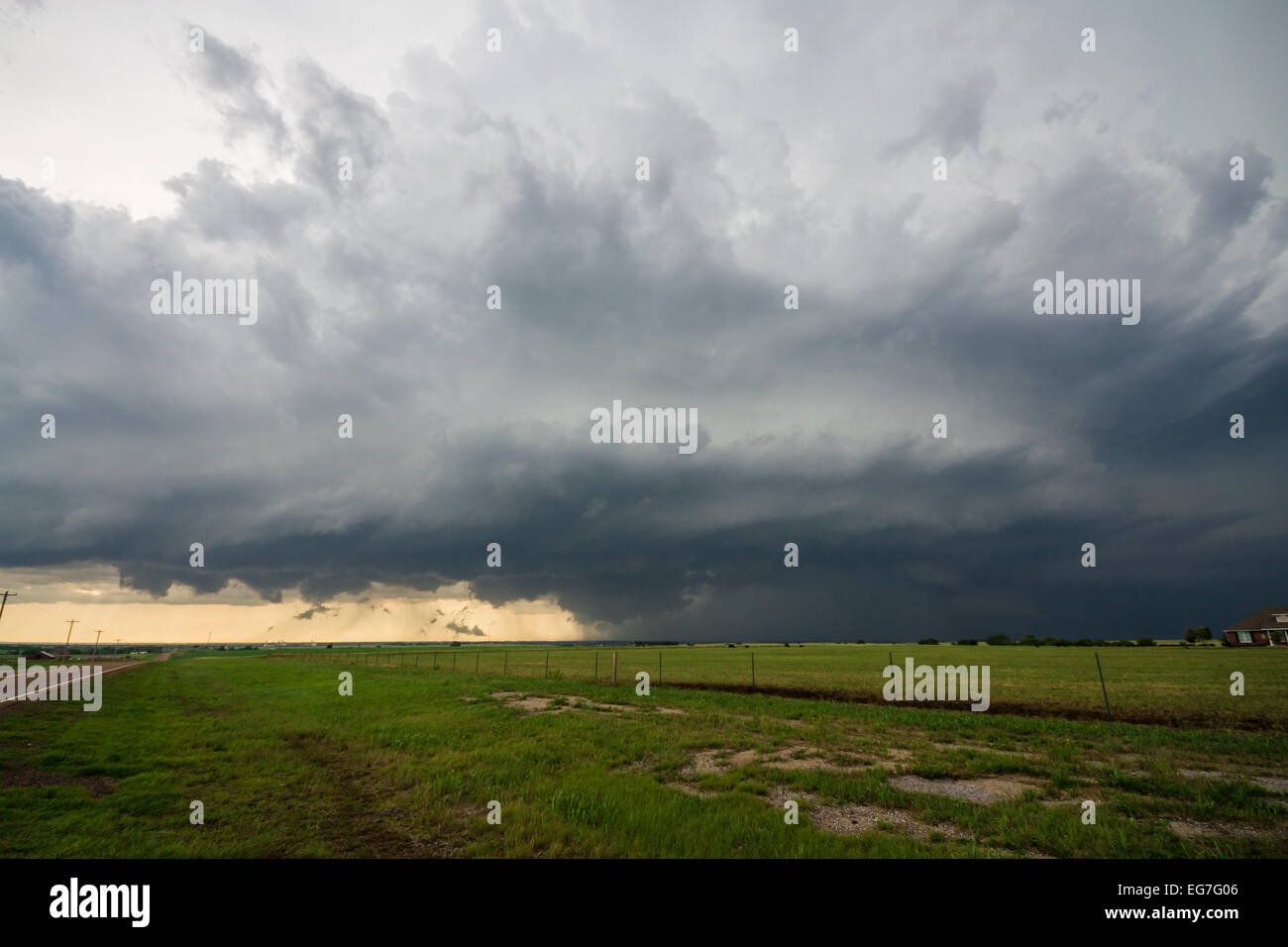 A powerful supercell thunderstorm takes shapes with a twisting updraft ...