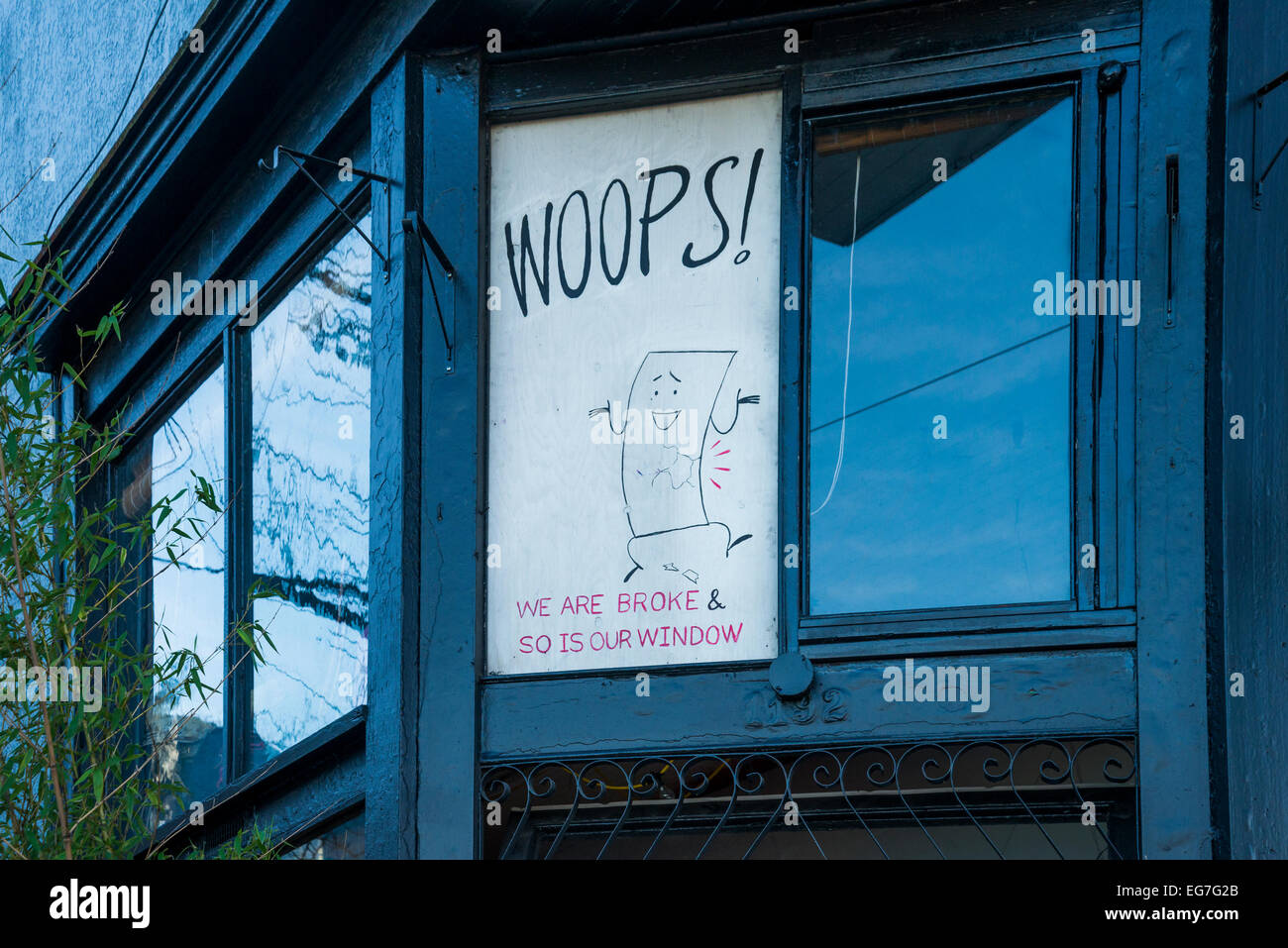 Sign in broken window Stock Photo - Alamy