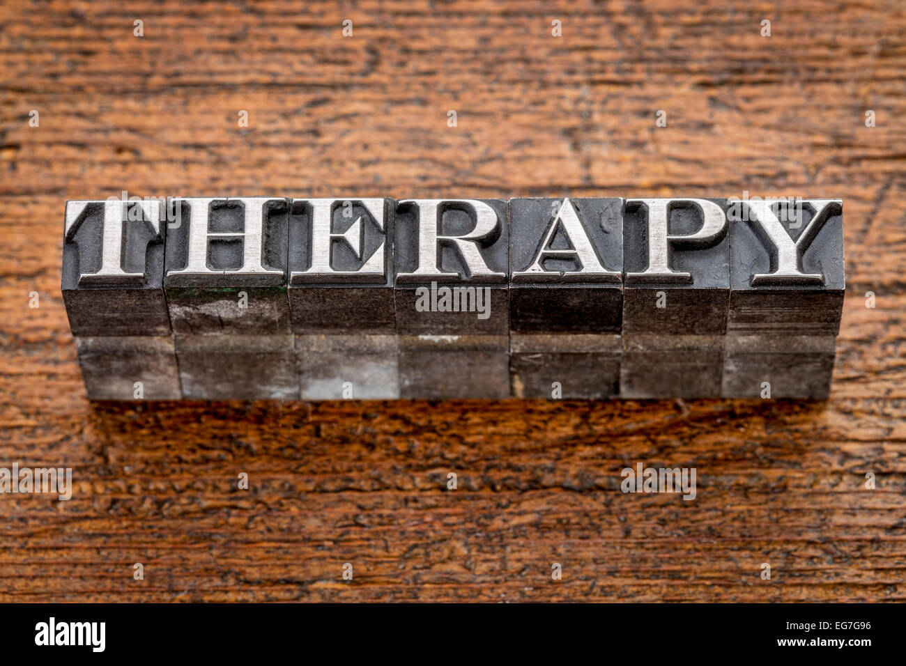 therapy word in mixed vintage metal type printing blocks over grunge ...