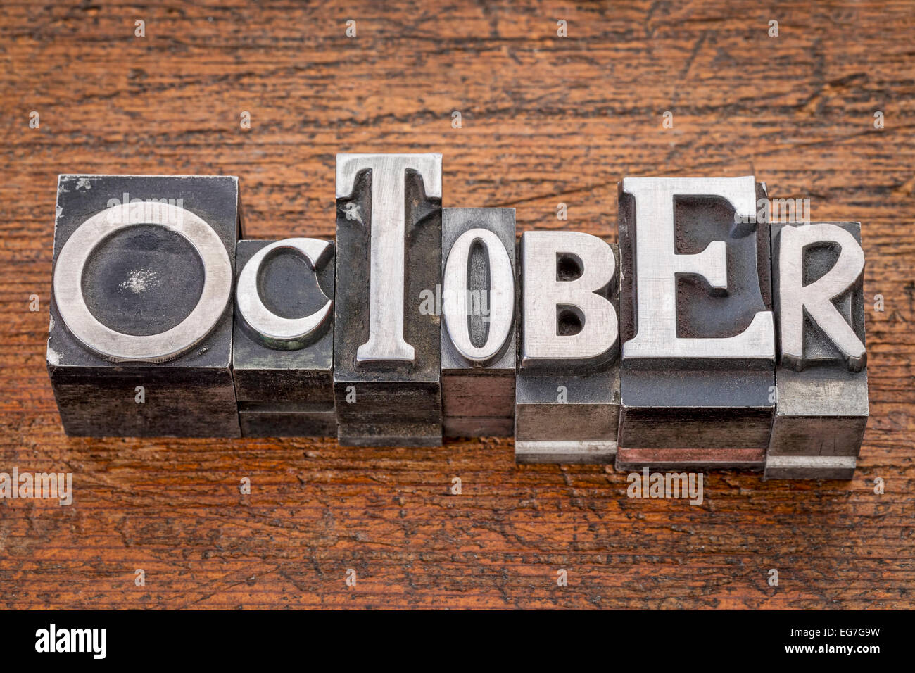 October word in mixed vintage metal type printing blocks over grunge ...