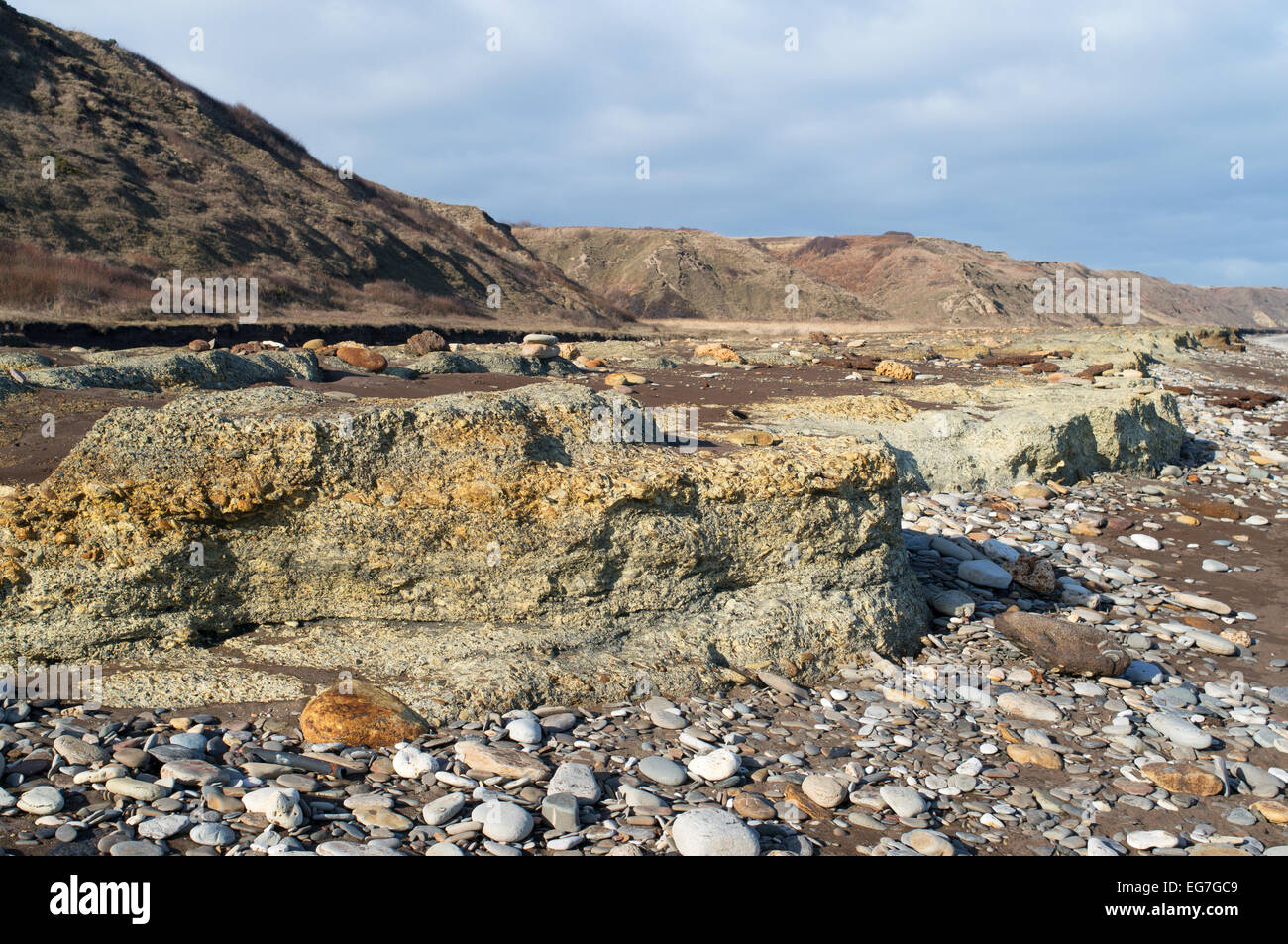 Blackhall Colliery beach showing eroded layer of coal mining waste ...