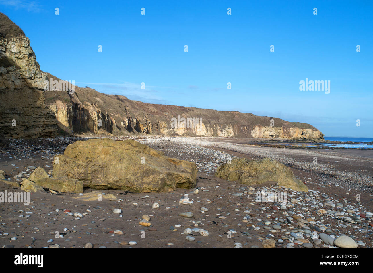 The beach and magnesium or magnesian limestone cliffs at Blackhall ...