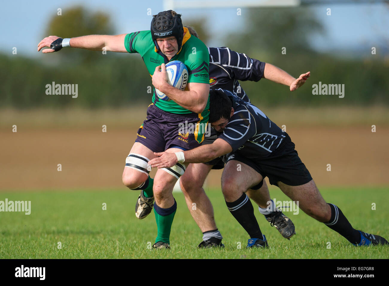 Rugby, player being tackled Stock Photo - Alamy