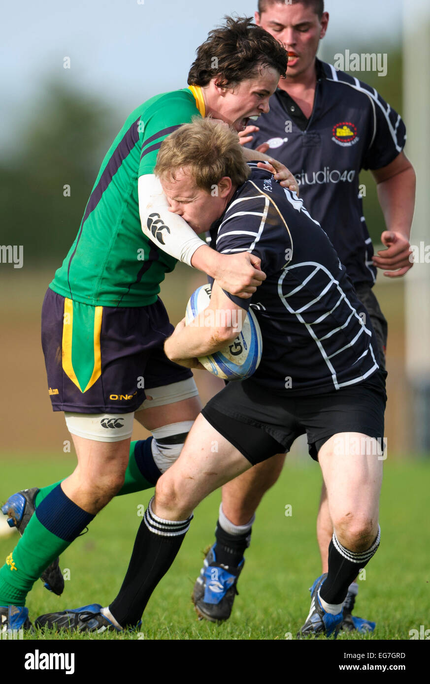 Rugby, player being tackled Stock Photo - Alamy