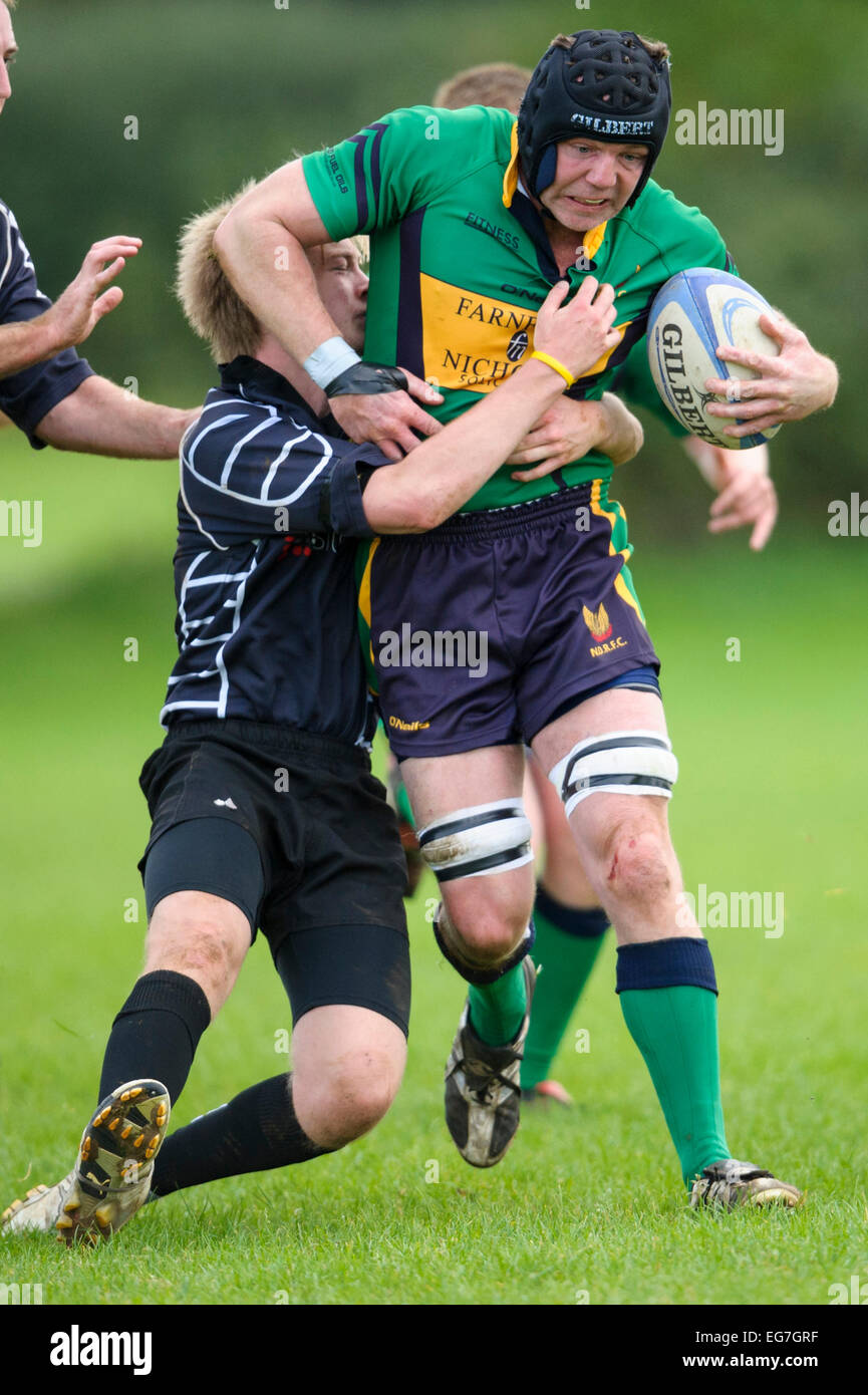 Rugby, player being tackled Stock Photo - Alamy