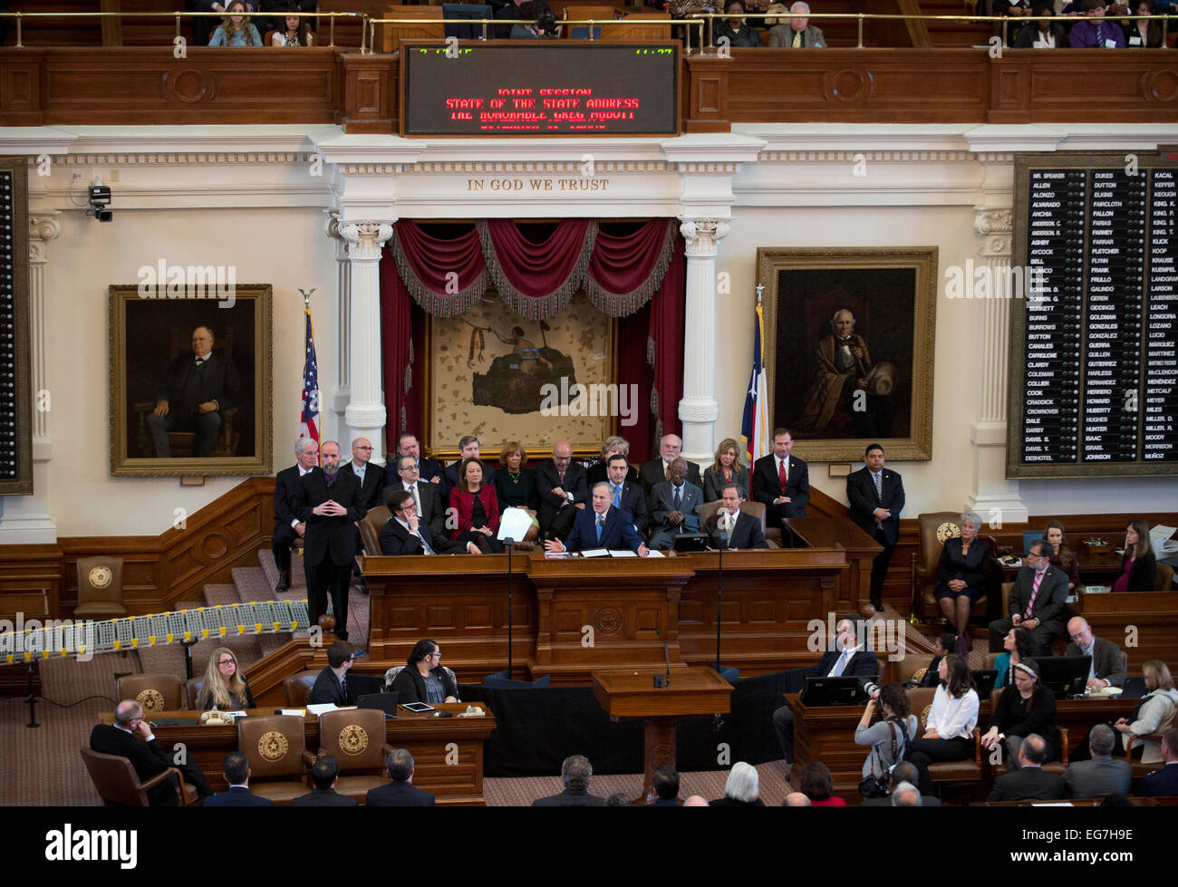 State officials crowd the dais as Texas Gov. Greg Abbott gives his ... State officials crowd the dais as Texas Gov. Greg Abbott gives his ...
