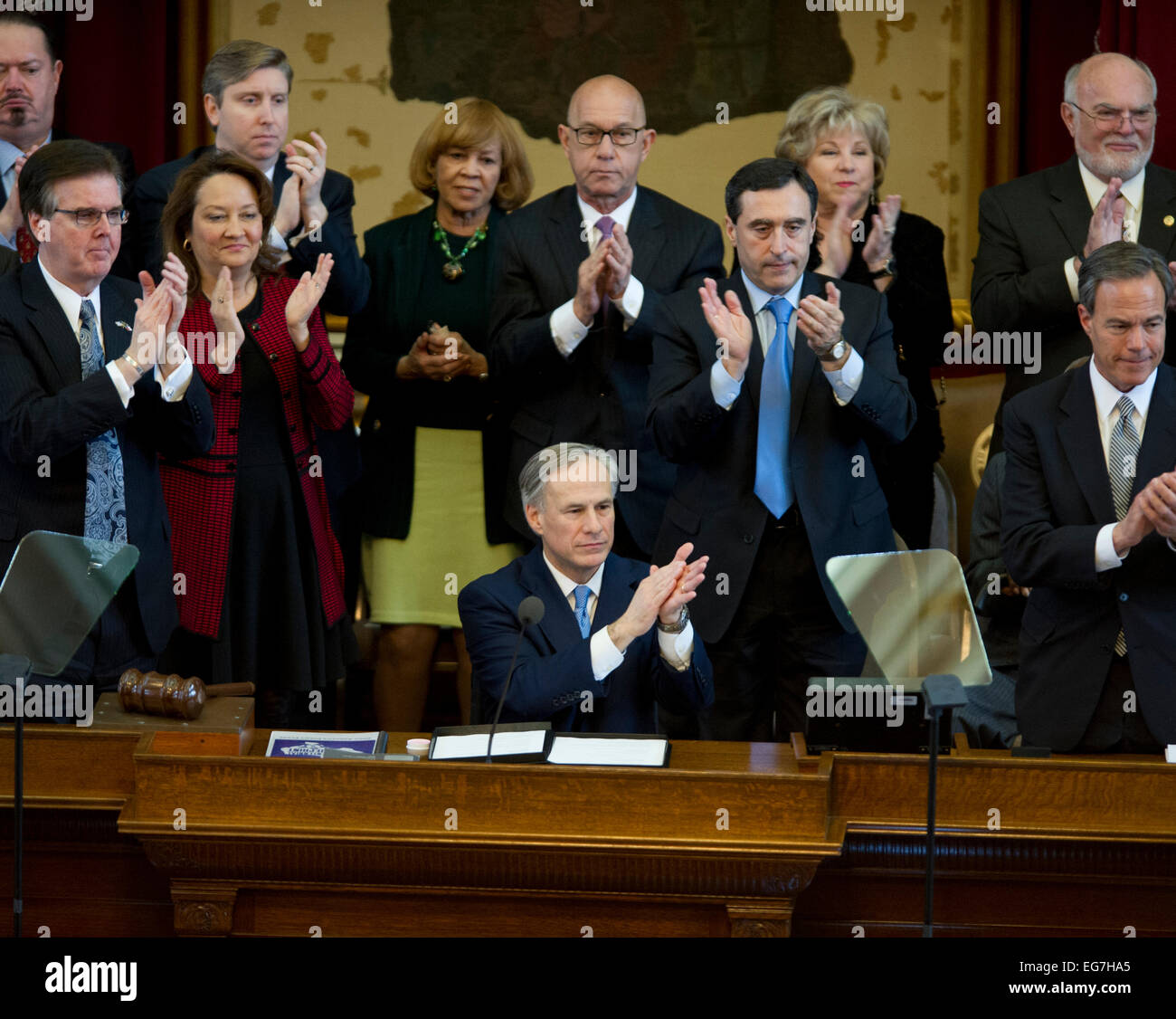 Texas Governor Greg Abbott (center) surrounded by state officials while ... Texas Governor Greg Abbott (center) surrounded by state officials while ...